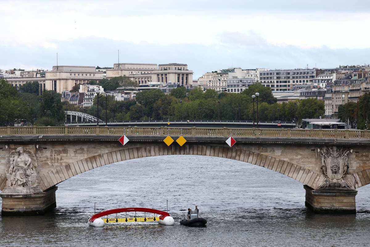Olympic triathletes test swimming in the Seine amid water quality ...