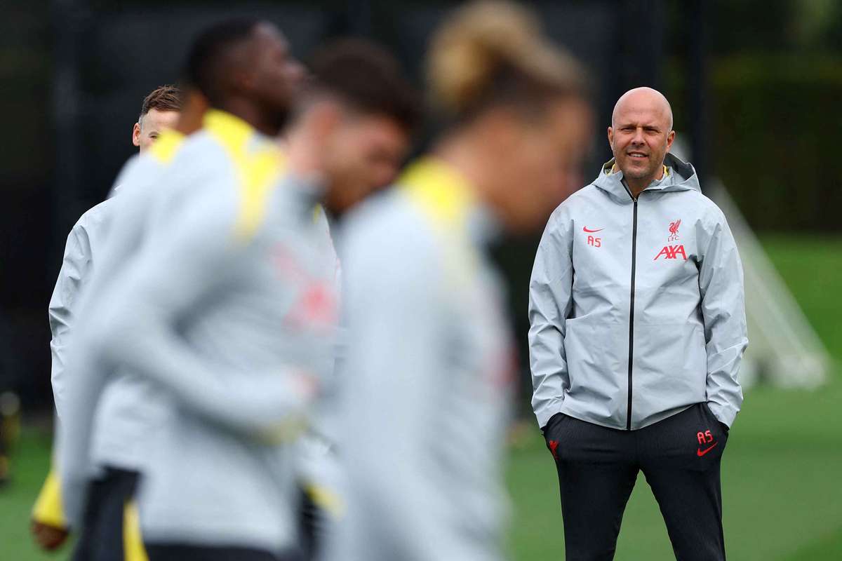 Liverpool's Arne Slot says it is too early to be excited about topping ...