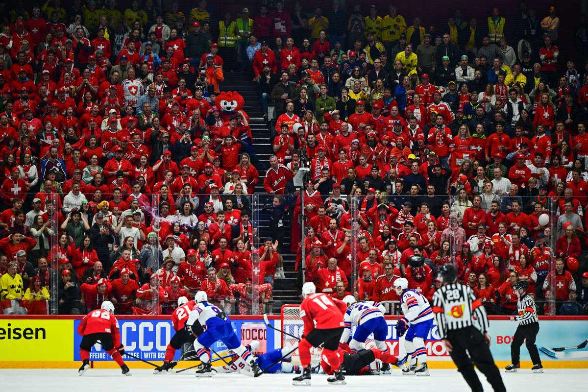 USA score sudden-death winner to beat Switzerland and win ice hockey ...