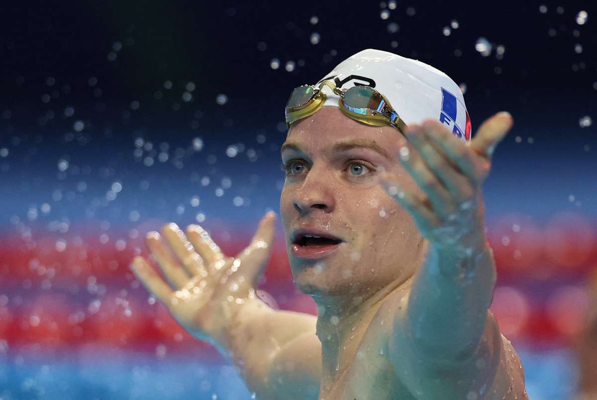 Olympic gold medallist Marchand smashes 200m IM record at world ...