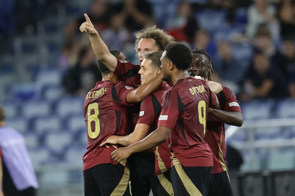 Belgium fight back from two goals down to claim point against 10-man ...