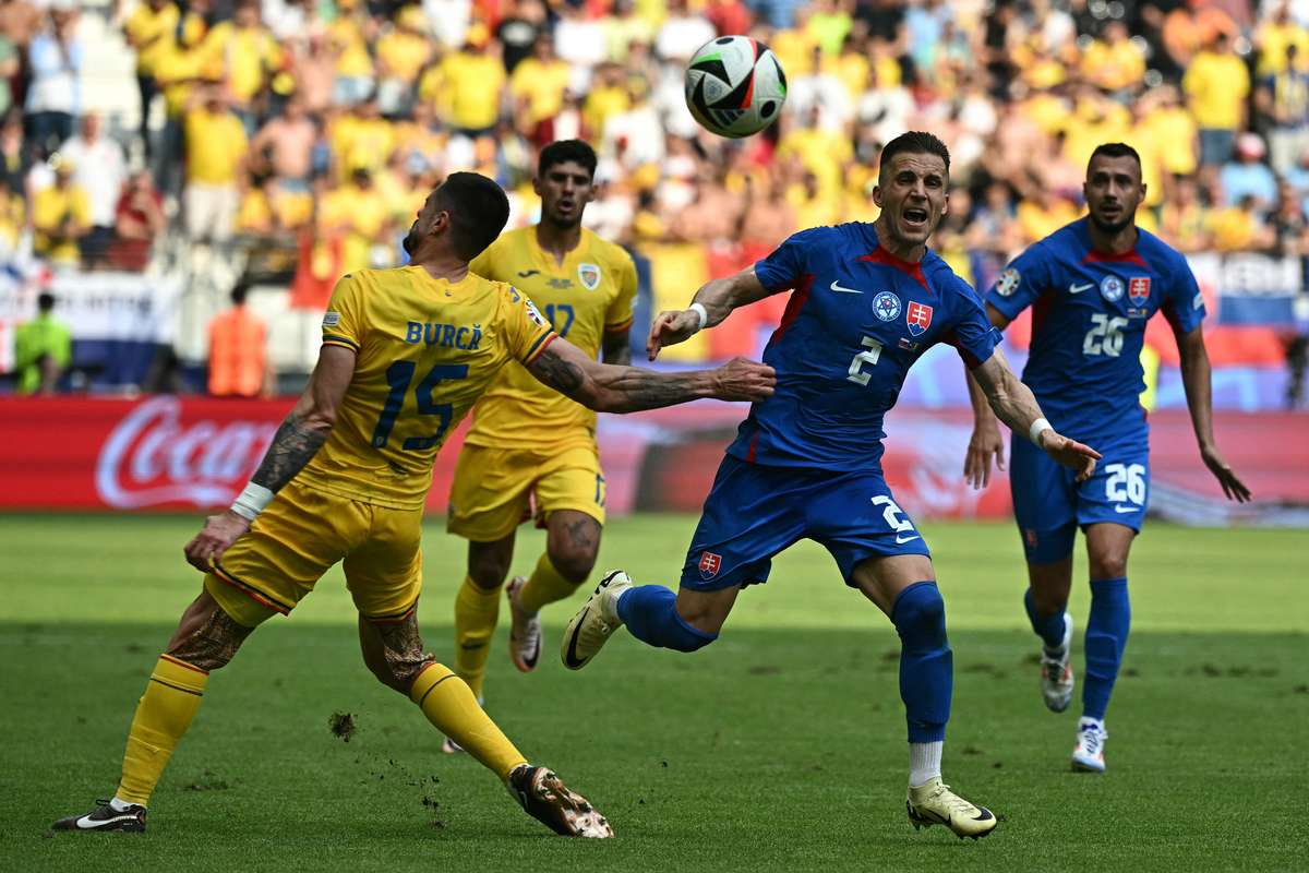 Romania come back to draw with Slovakia as both sides progress from ...